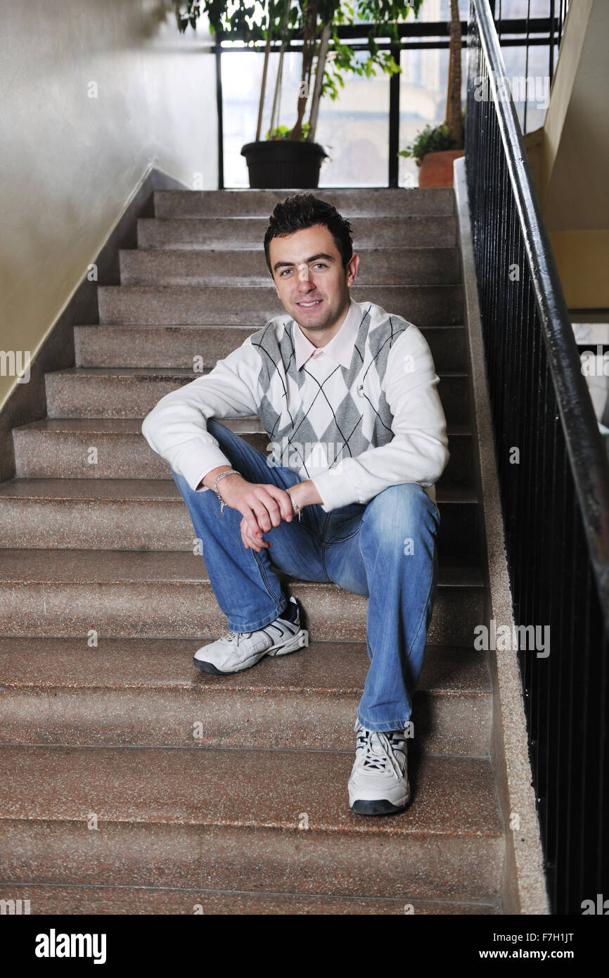 happy young student boy posing at university school classroom Stock ...