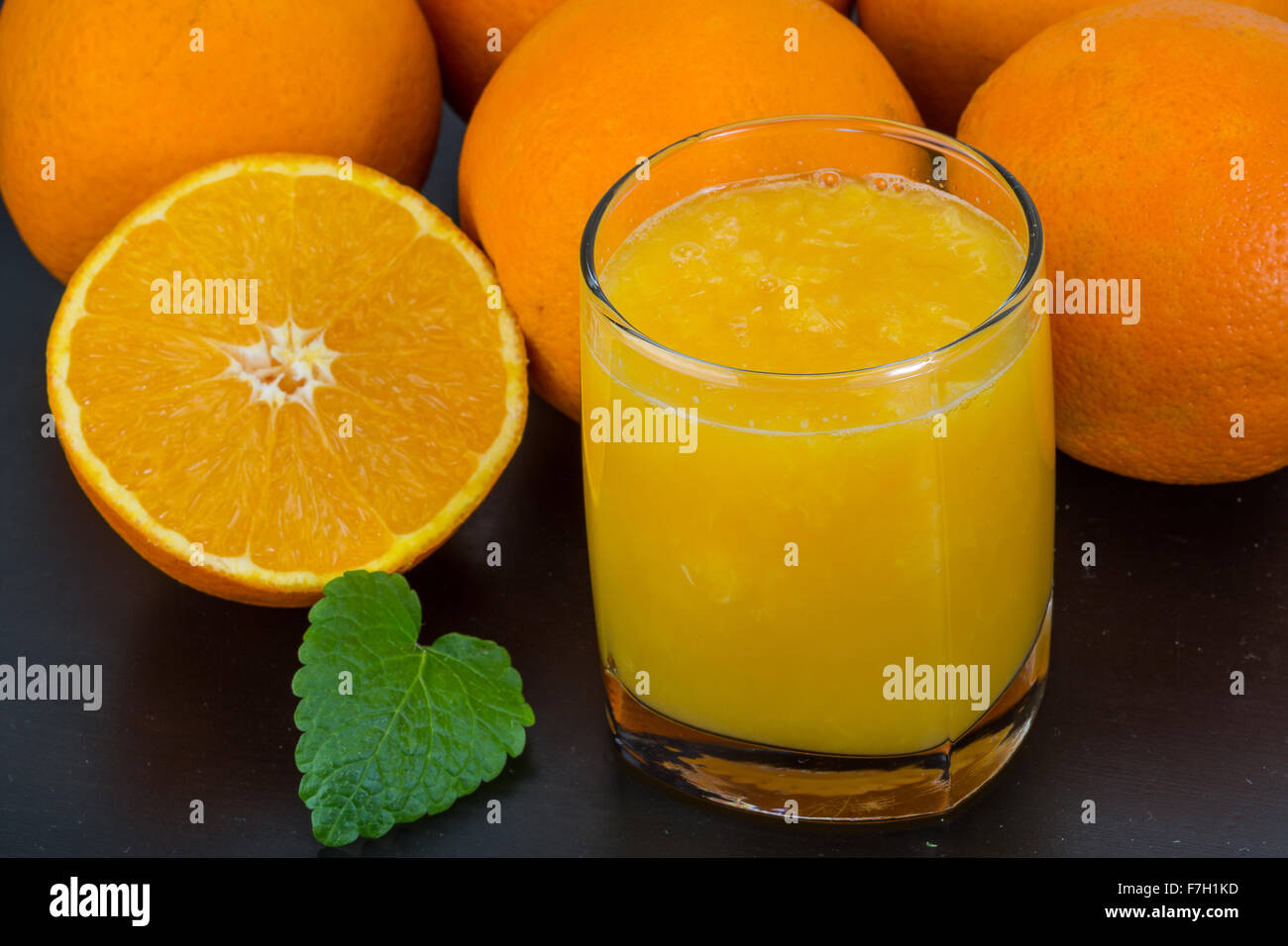 Fresh made Orange juice with ripe fruits Stock Photo - Alamy