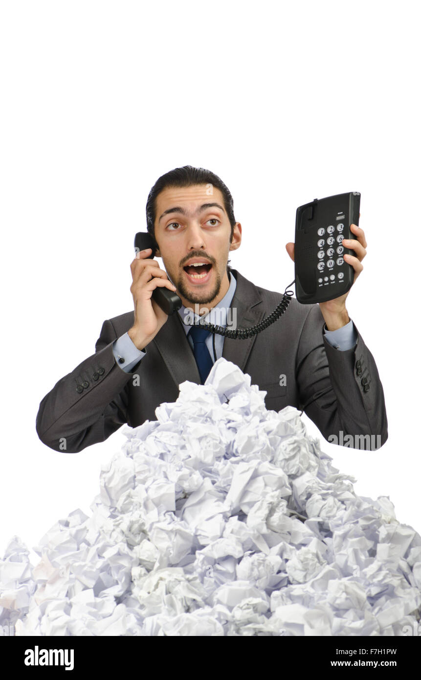 Man with lots of crumpled paper Stock Photo - Alamy