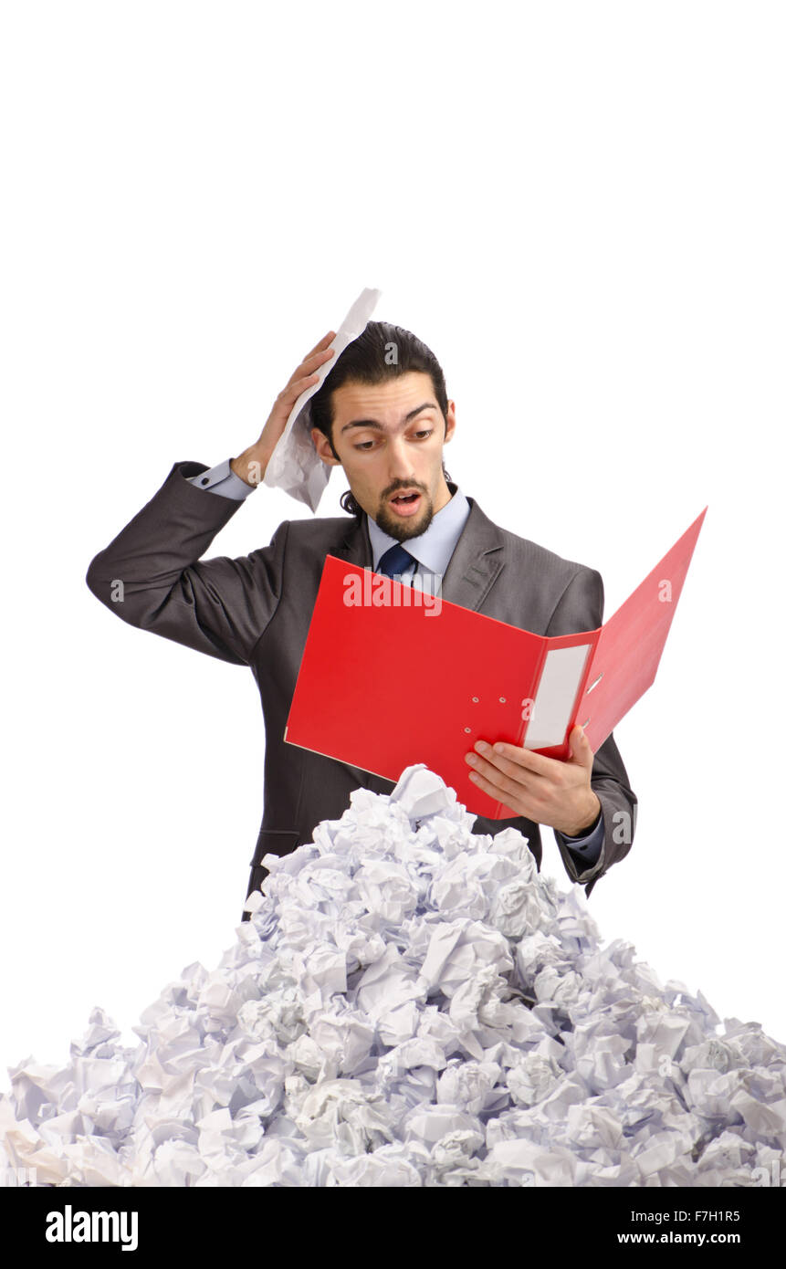 Man with lots of crumpled paper Stock Photo - Alamy