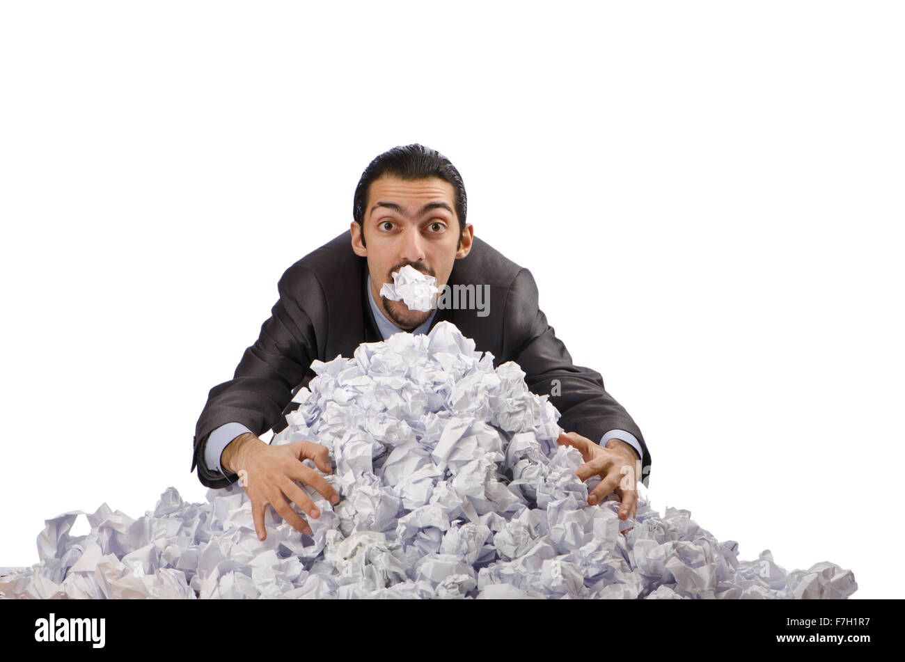 Man with lots of waste paper Stock Photo - Alamy