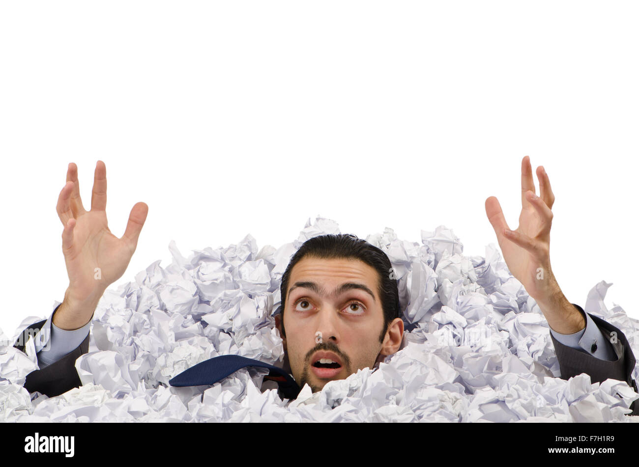 Man with lots of crumpled paper Stock Photo - Alamy