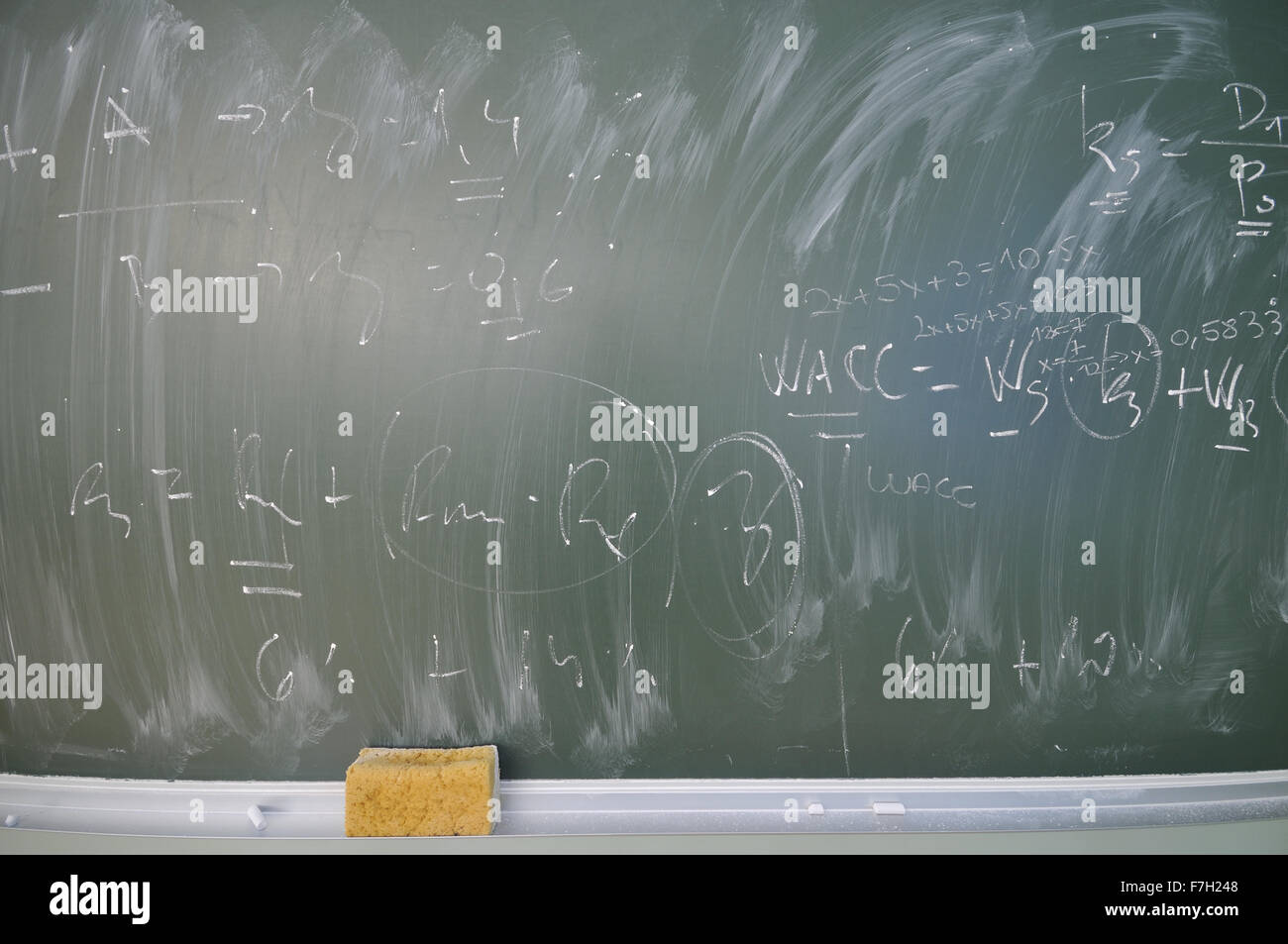 green board at university classroom with writen ecenomy and finance ...