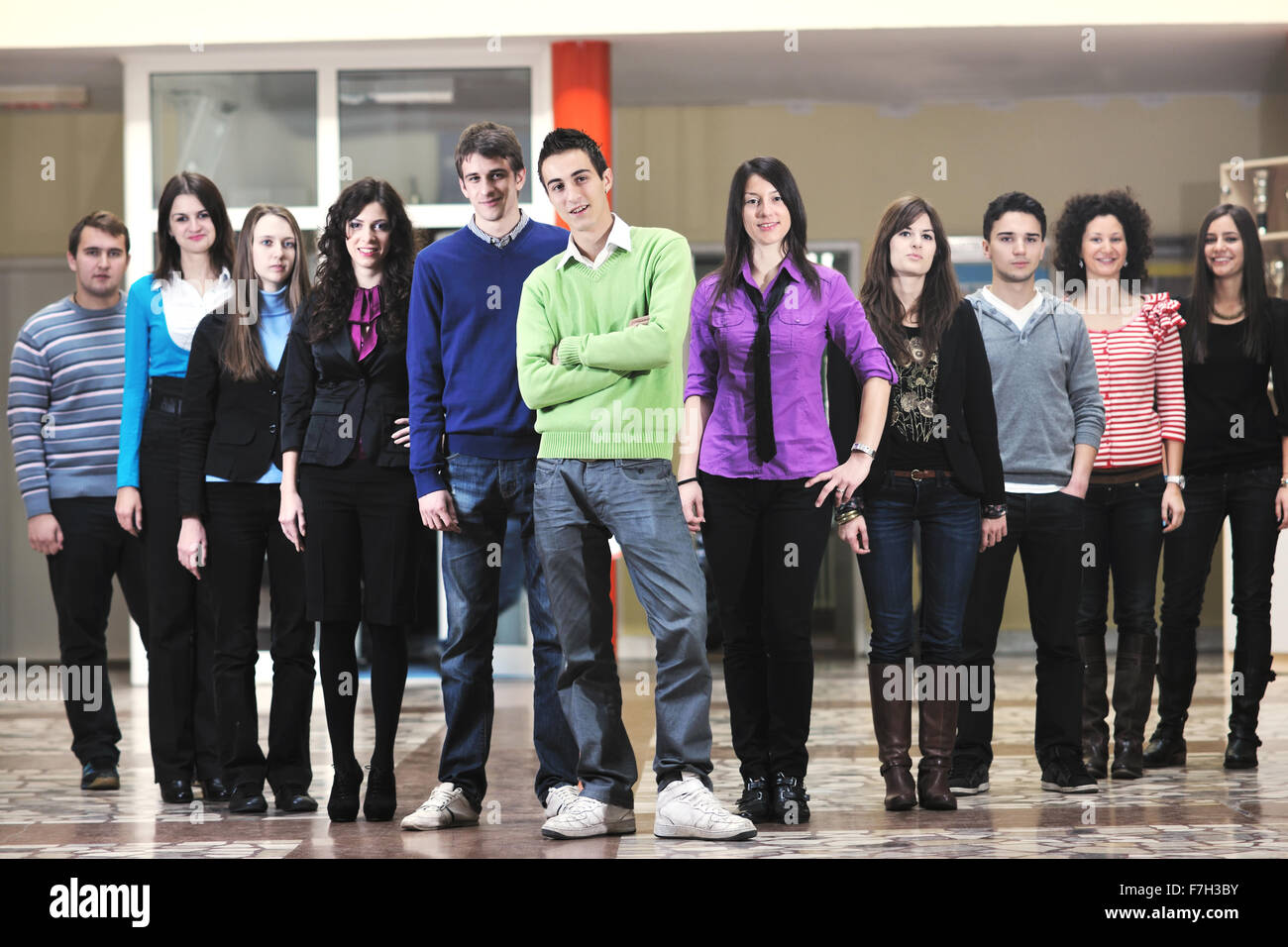 happy students people group portrait at university indoor building ...