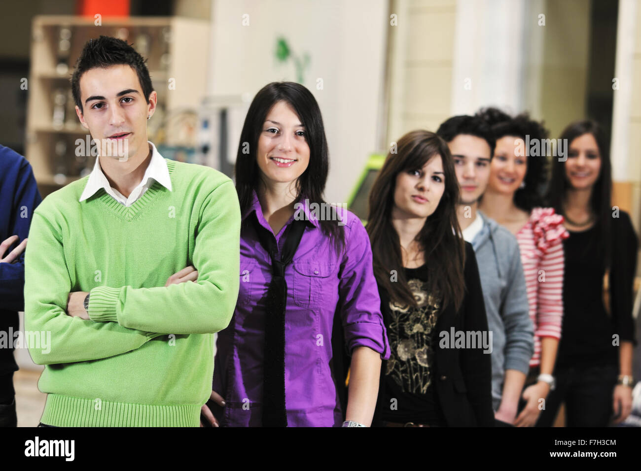 happy students people group portrait at university indoor building ...
