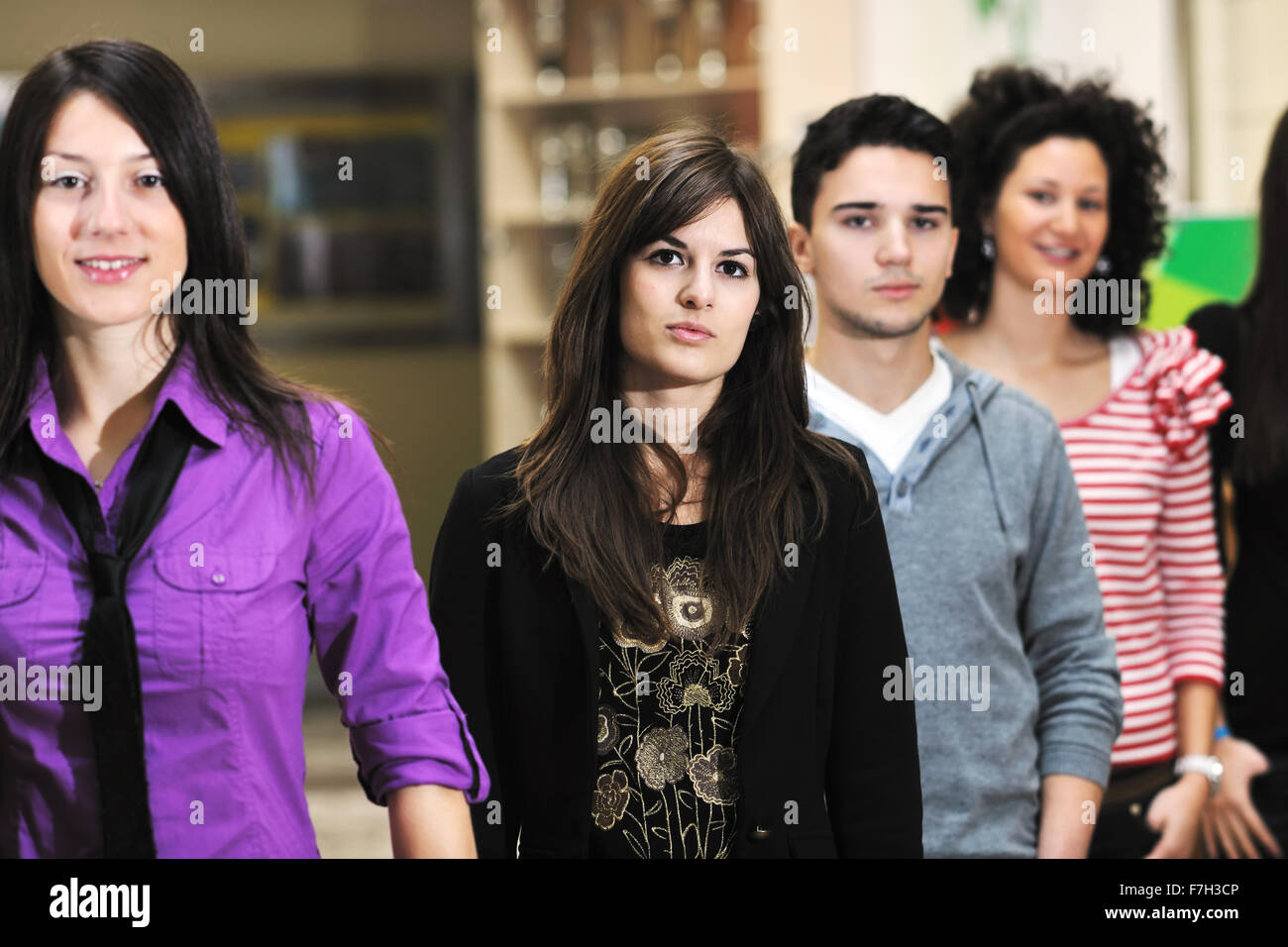 happy students people group portrait at university indoor building ...