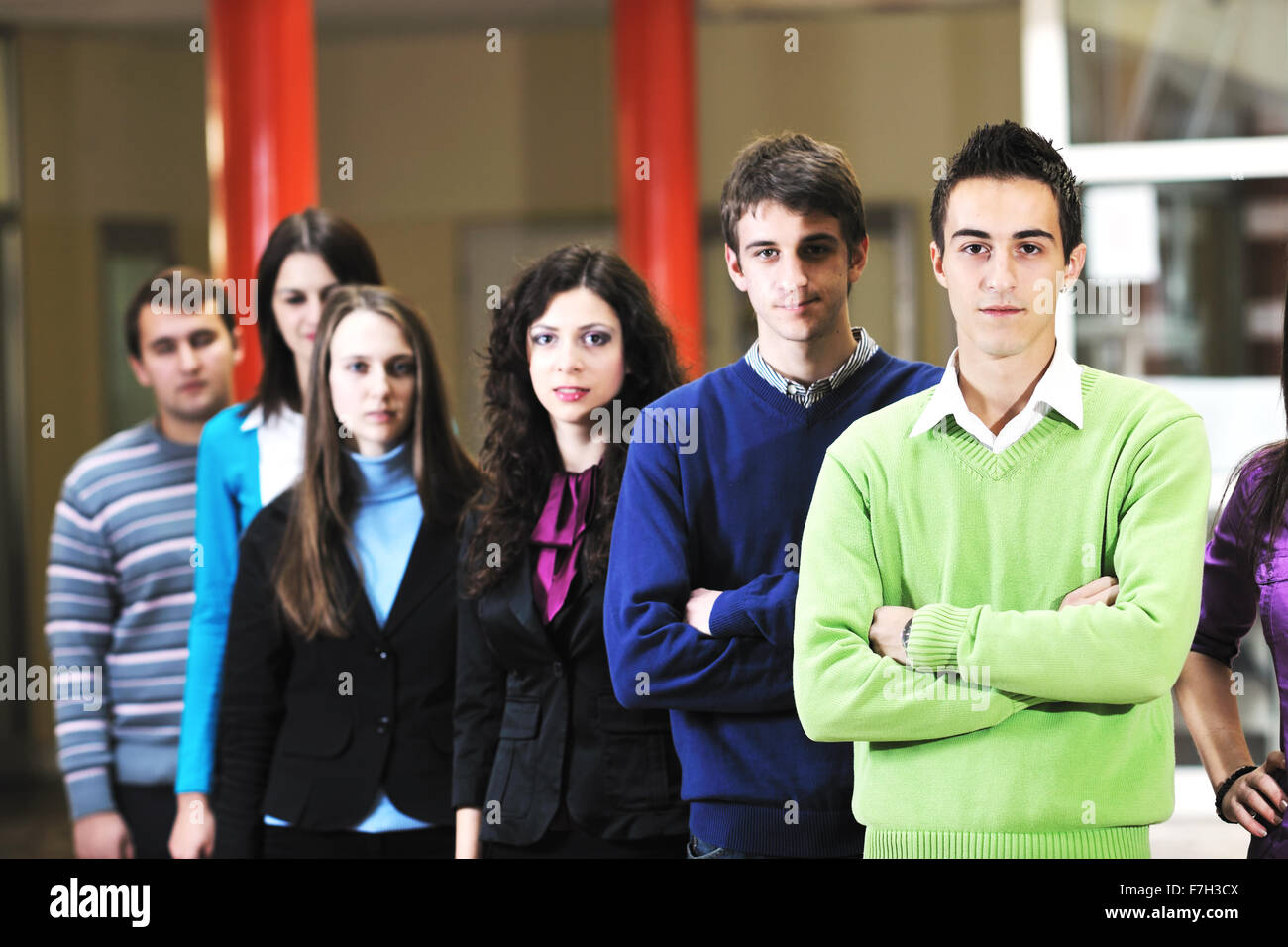 happy students people group portrait at university indoor building ...