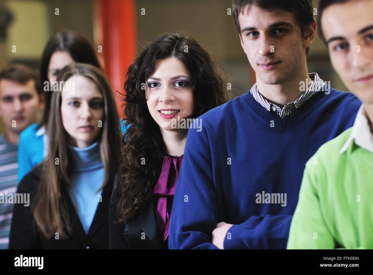 happy students people group portrait at university indoor building ...