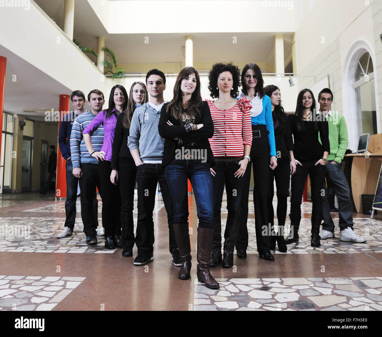 happy students people group portrait at university indoor building ...