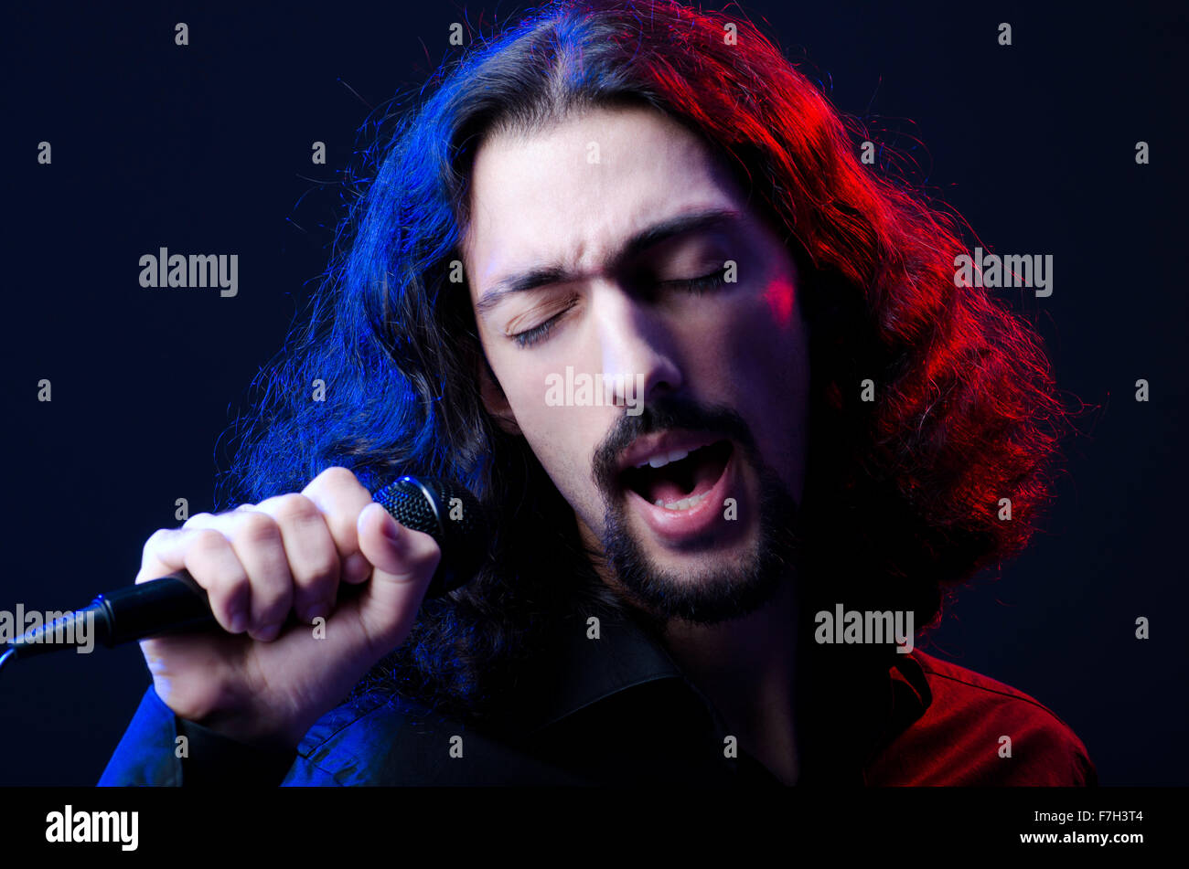 Man singing at the concert Stock Photo - Alamy