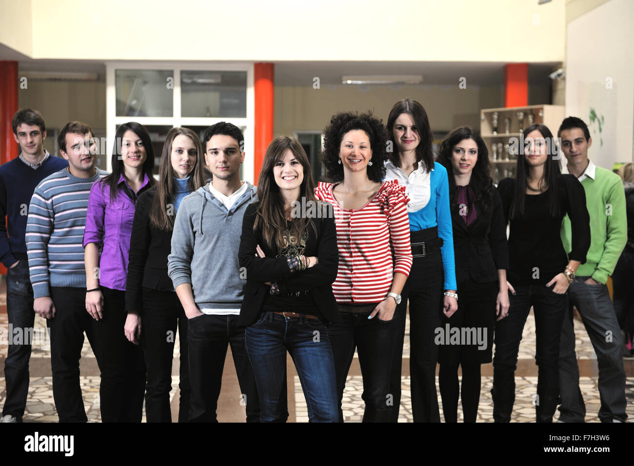 happy students people group portrait at university indoor building ...