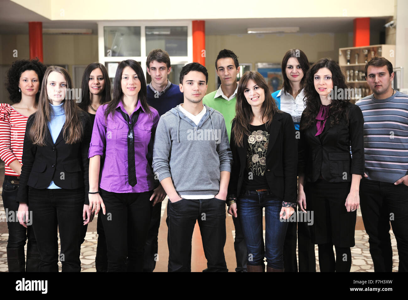 happy students people group portrait at university indoor building ...