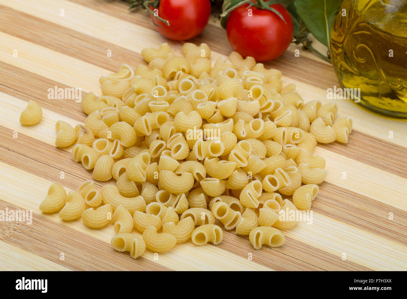 Pipe rigate pasta on the wood background Stock Photo - Alamy
