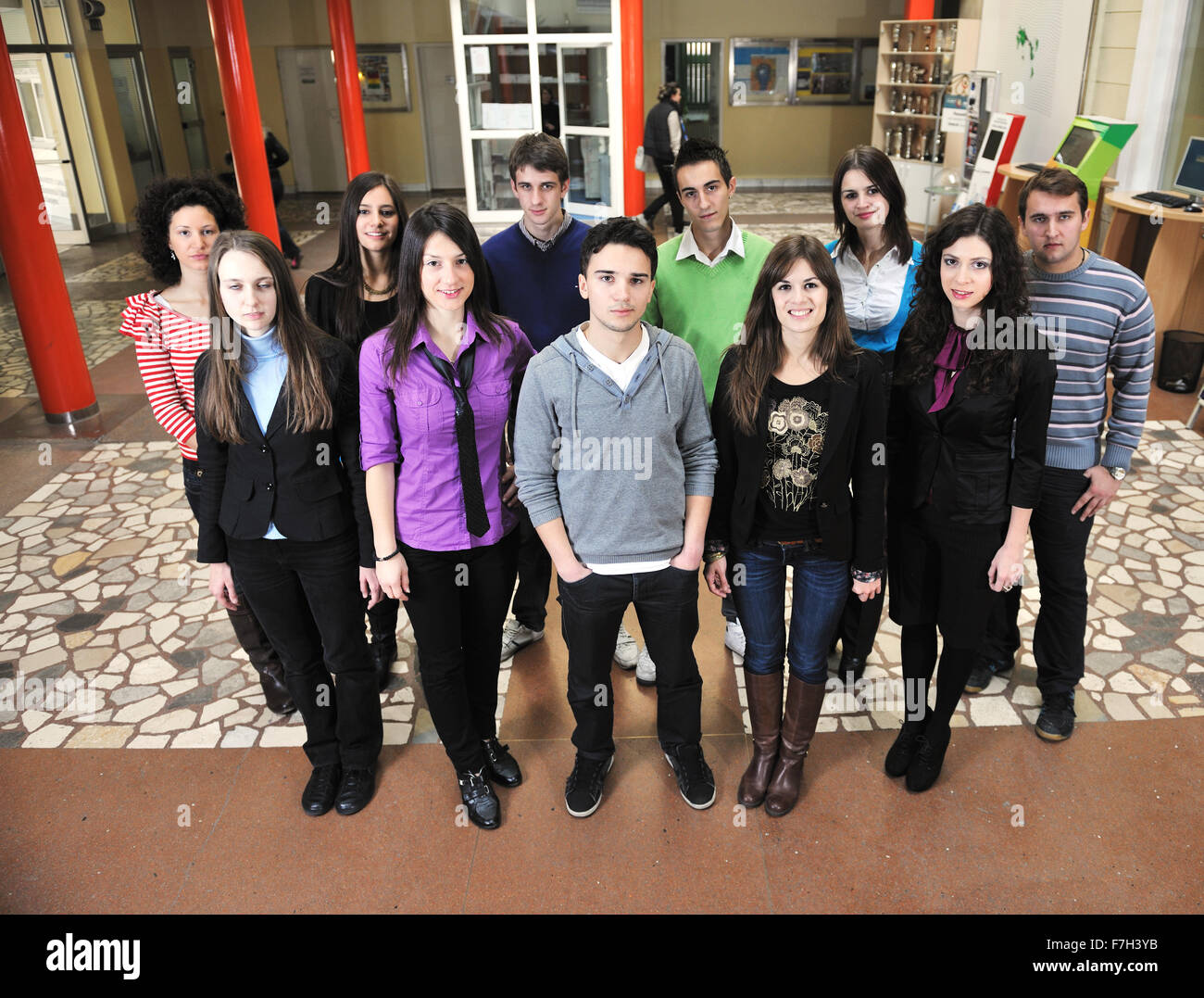 happy students people group portrait at university indoor building ...