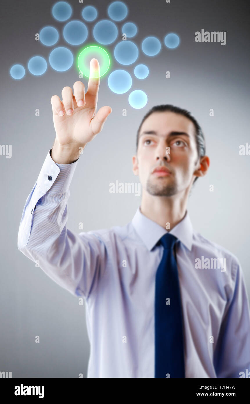Businessman pressing virtual buttons Stock Photo - Alamy