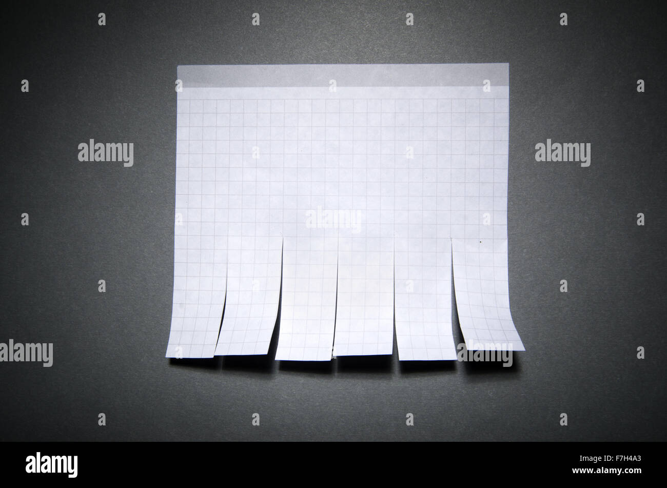 Tear off paper notice on the wall Stock Photo - Alamy