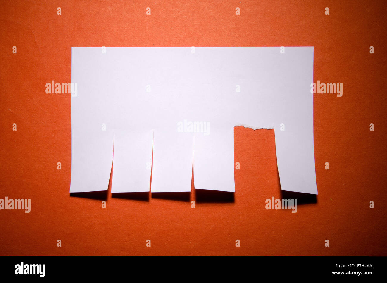 Tear off paper notice on the wall Stock Photo - Alamy