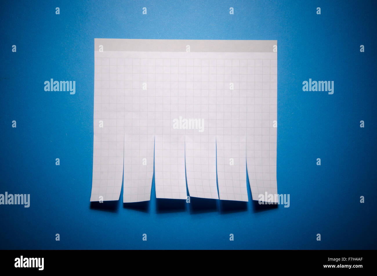 Tear off paper notice on the wall Stock Photo - Alamy