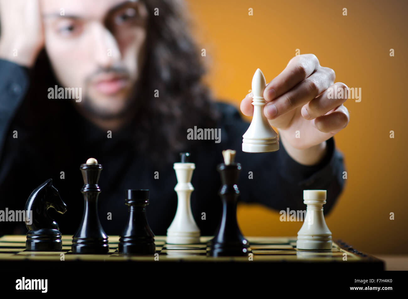 Chess player playing his game Stock Photo - Alamy
