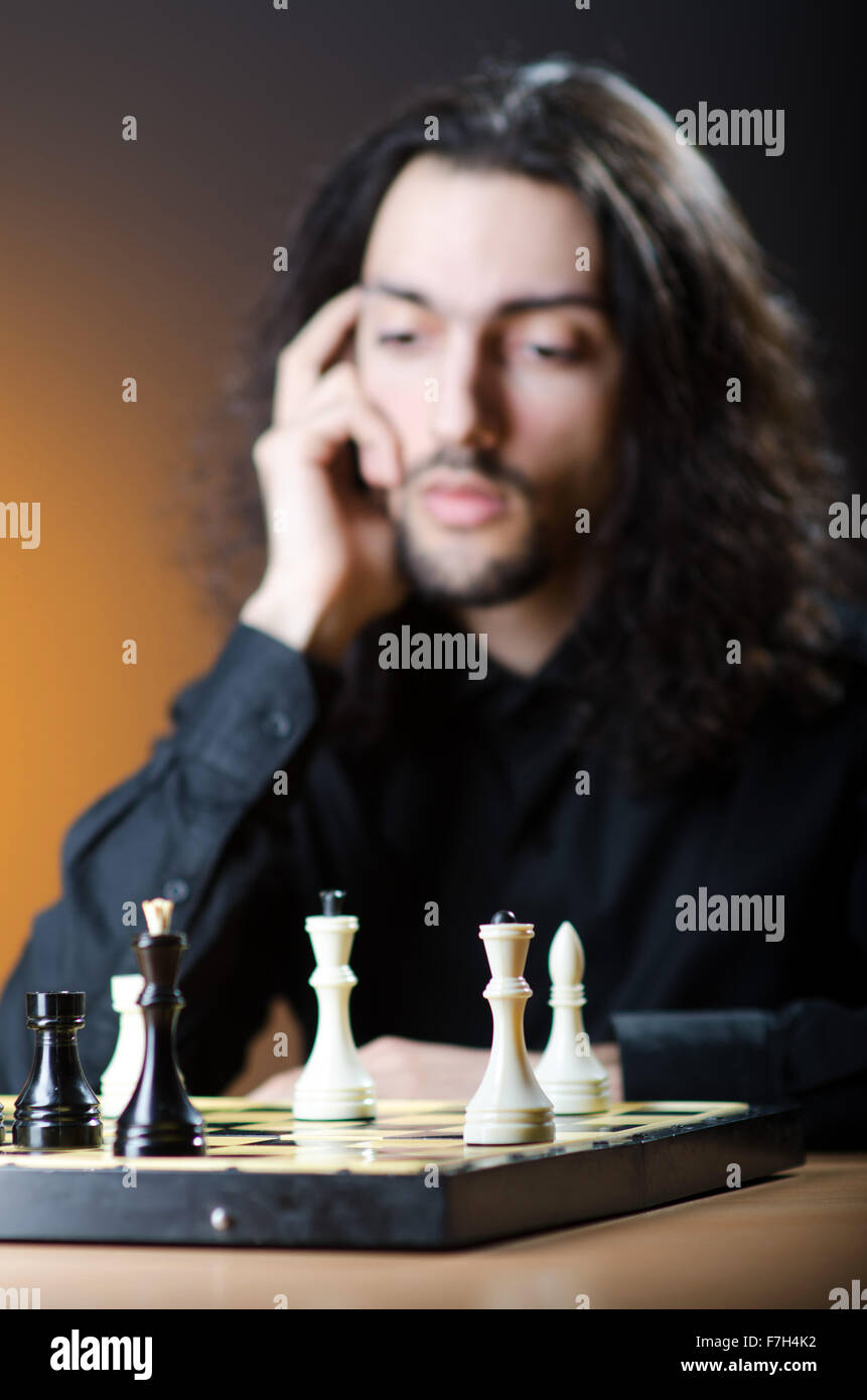 Chess player playing his game Stock Photo - Alamy