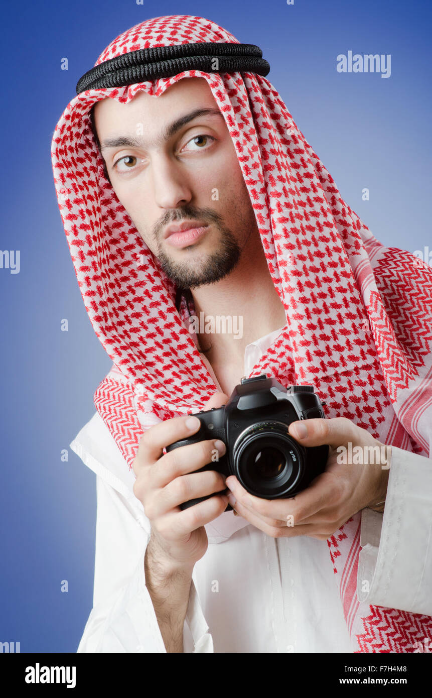 Arab photographer in studio shooting Stock Photo - Alamy