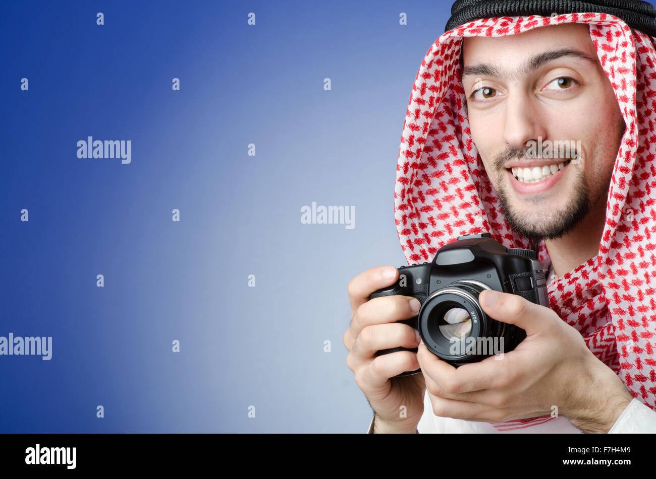 Arab photographer in studio shooting Stock Photo - Alamy