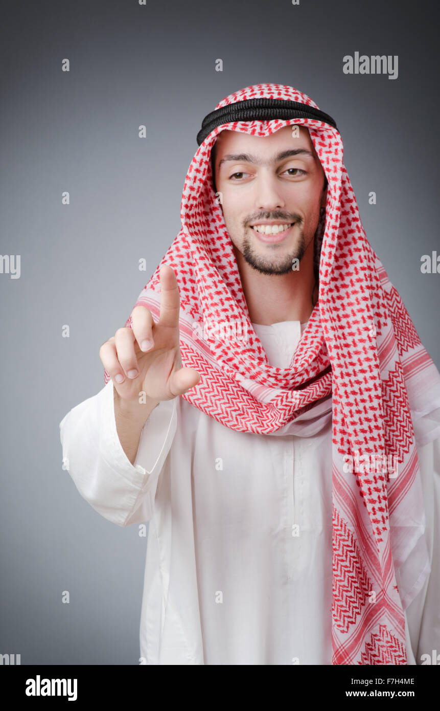 Arab pushing virtual buttons Stock Photo - Alamy