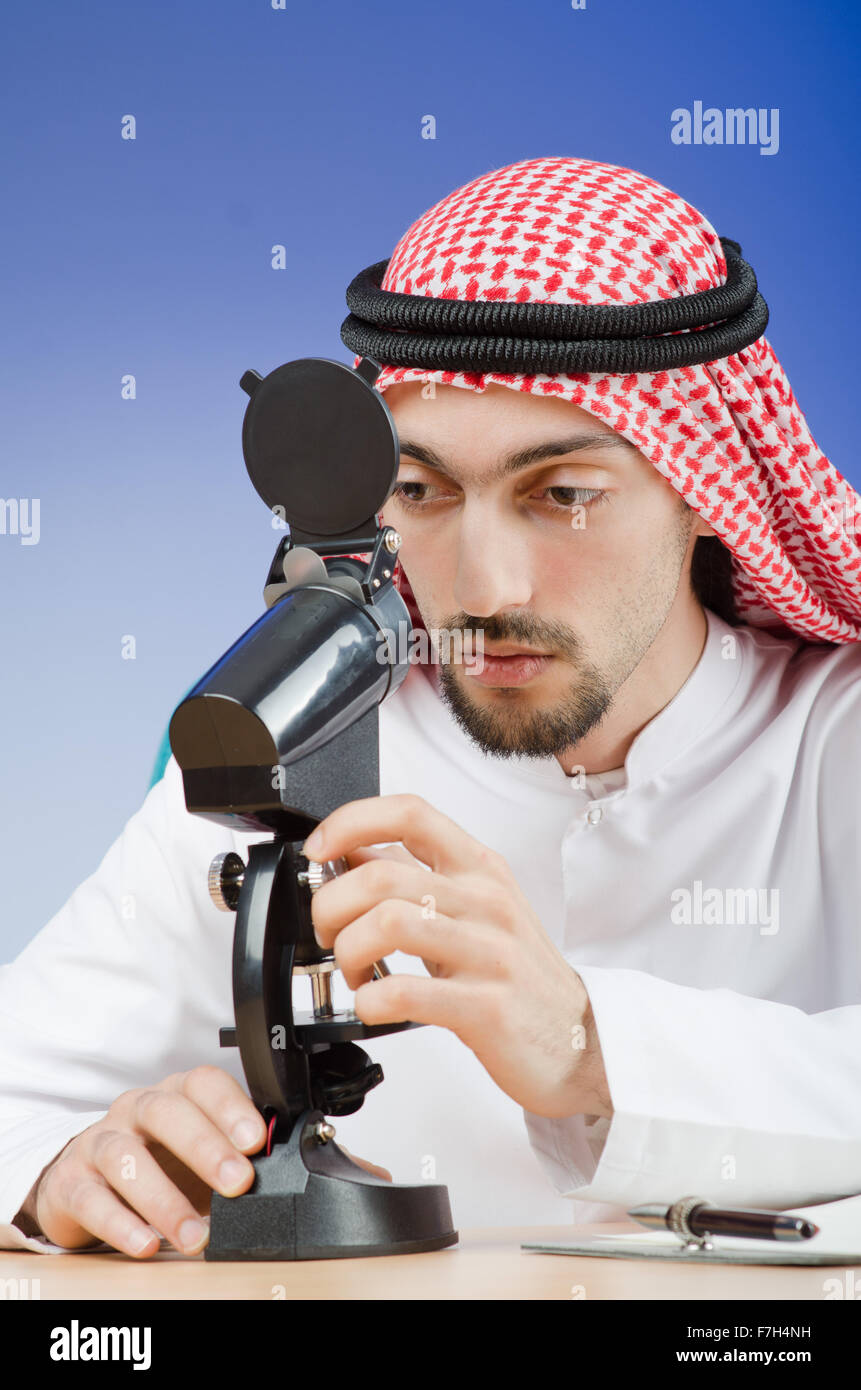 Arab chemist working in lab Stock Photo - Alamy