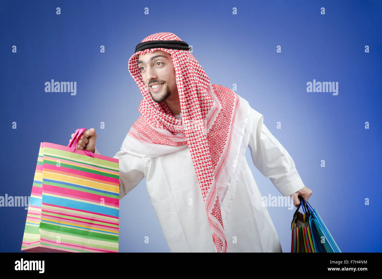 Arab with the gift bags Stock Photo - Alamy