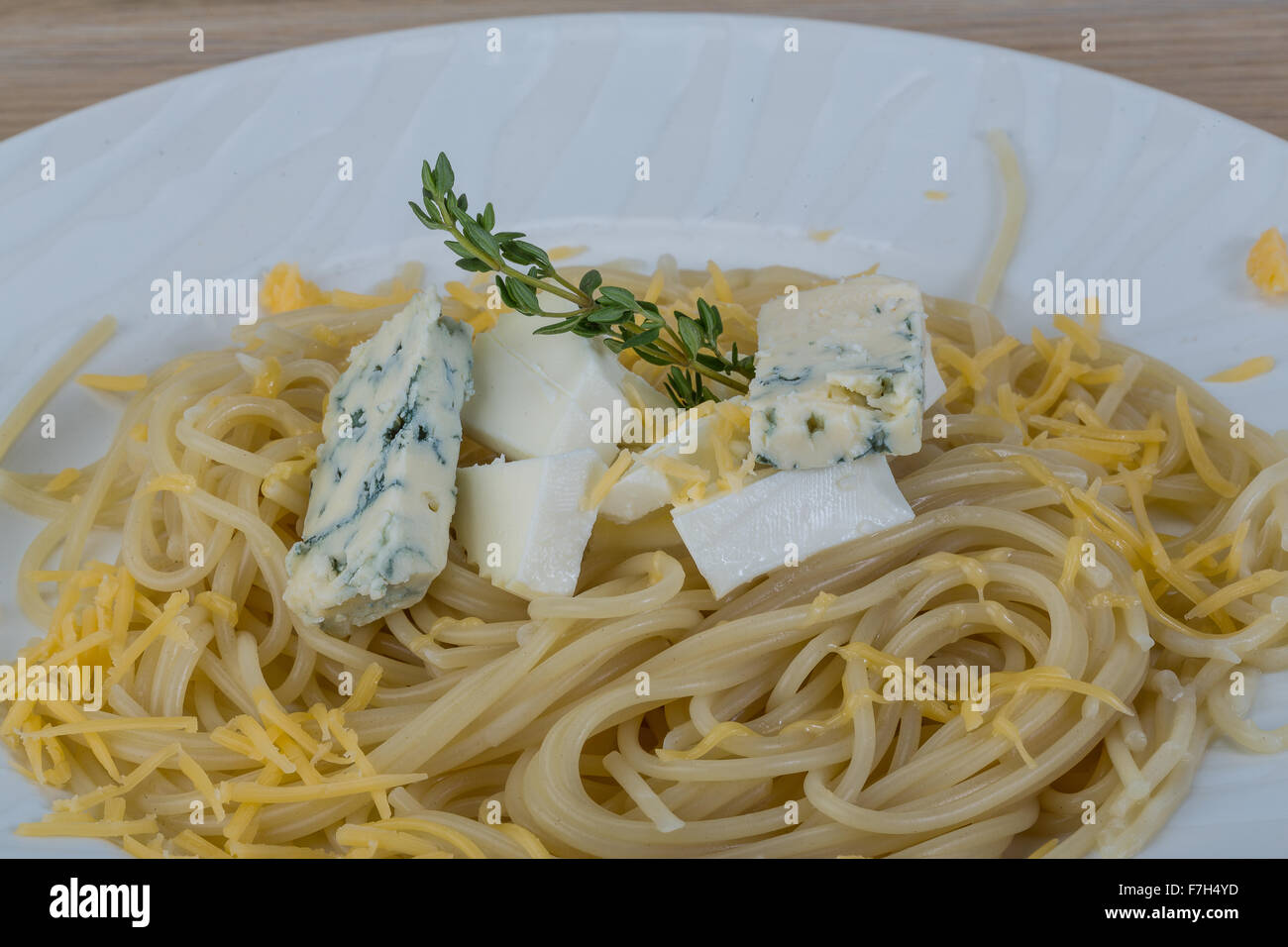 Spaghetti with blue, soft and parmesan cheeses Stock Photo - Alamy
