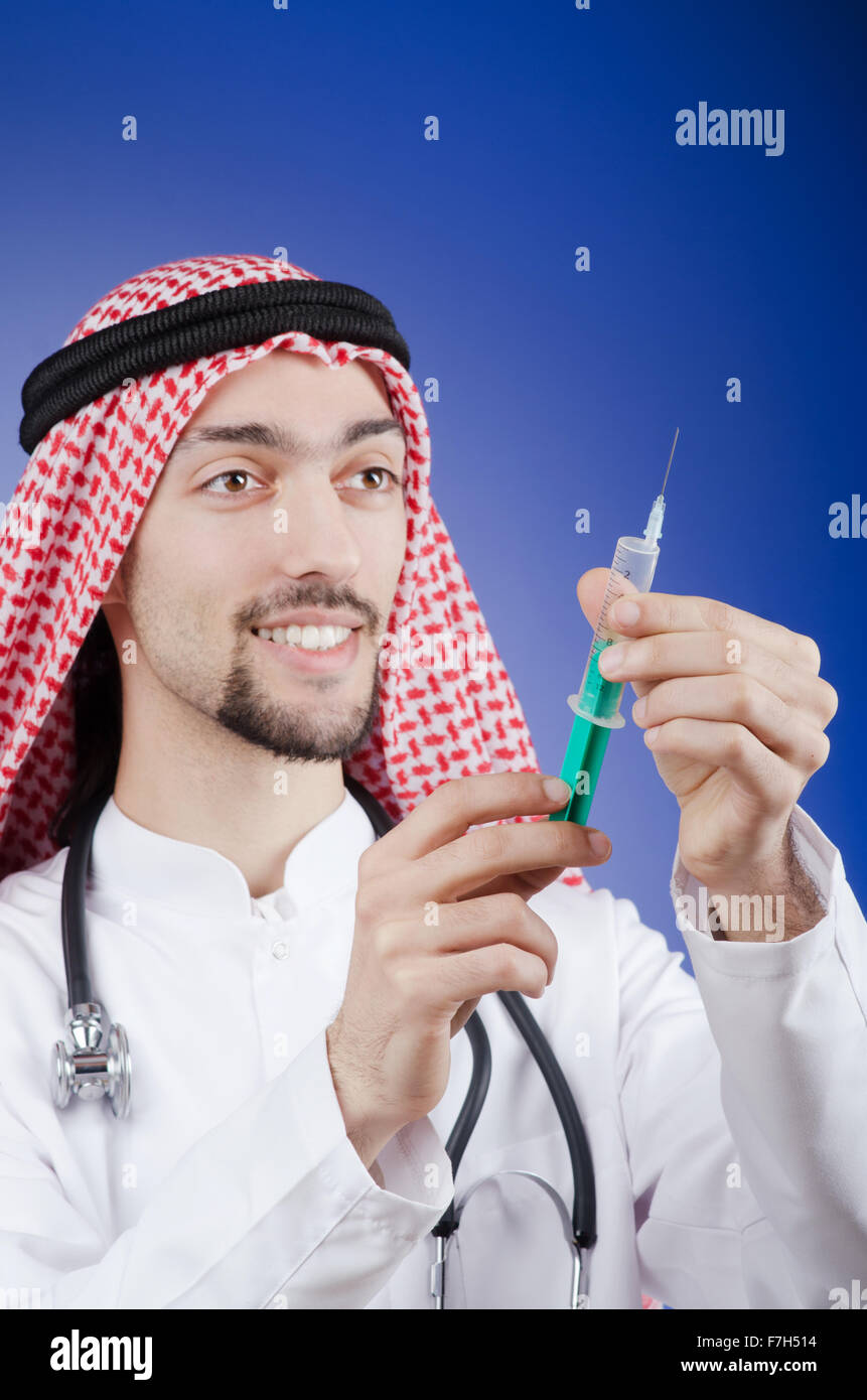 Arab doctor with syringe Stock Photo - Alamy