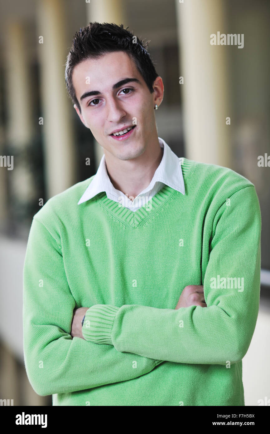 happy young student boy possing at university campus and reopresenting ...