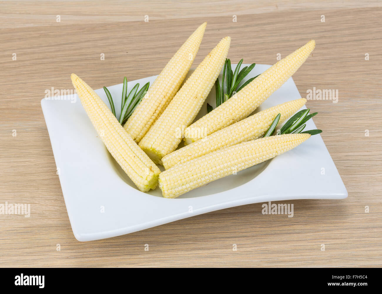 Fresh ripe Baby corn on the wood background Stock Photo - Alamy