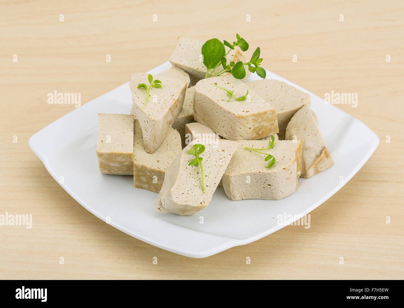 Tofu - soya cheese with herbs on the wood background Stock Photo - Alamy
