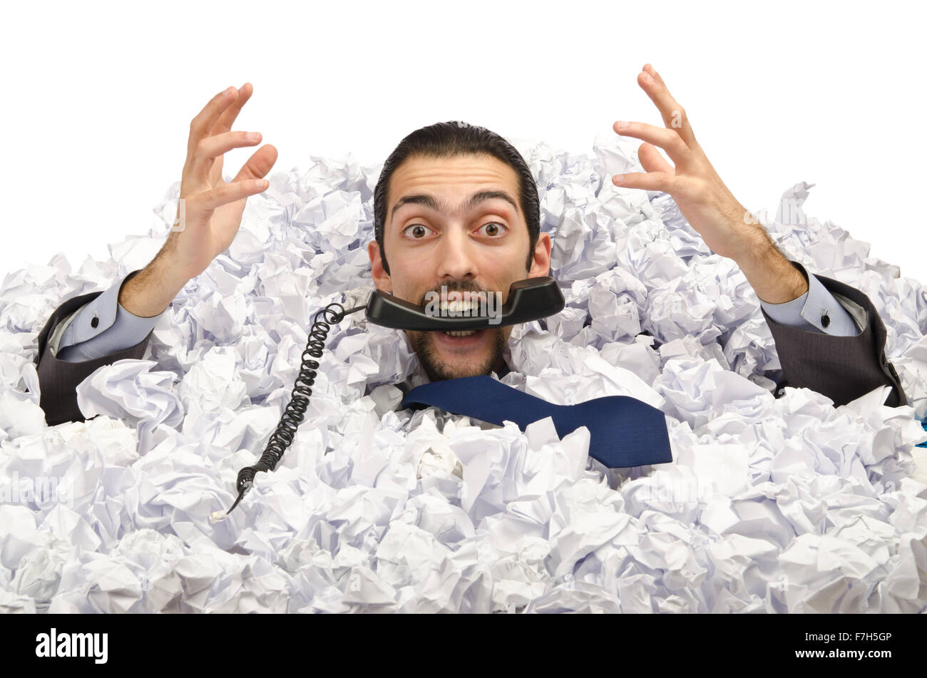 Man with lots of crumpled paper Stock Photo - Alamy