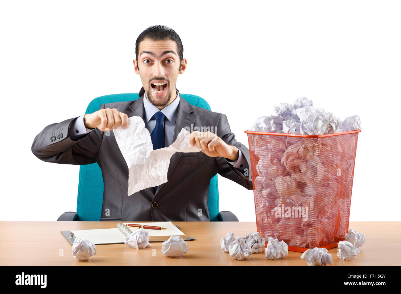 Man with lots of wasted paper Stock Photo - Alamy