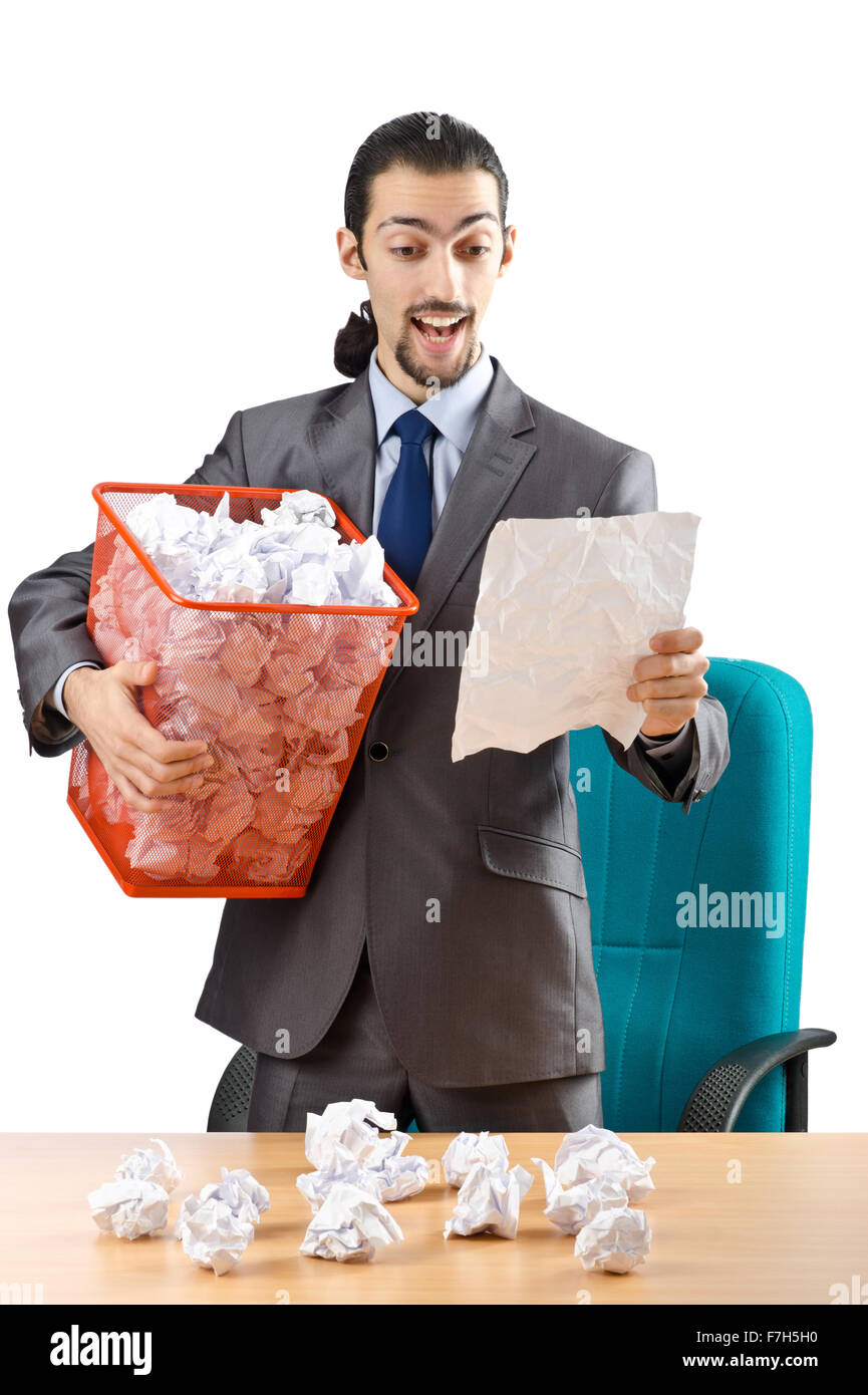 Man with lots of wasted paper Stock Photo - Alamy