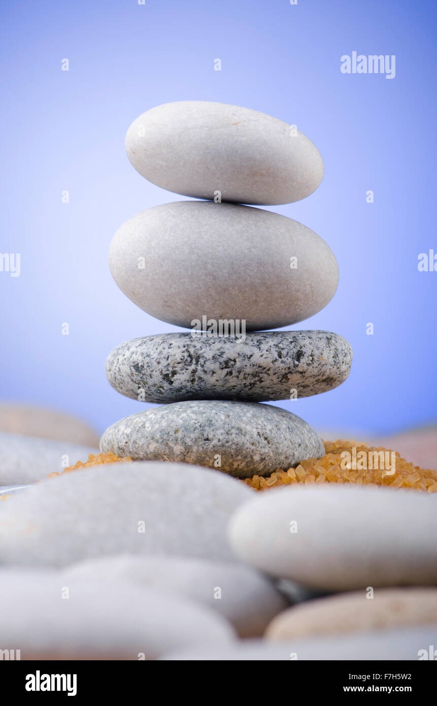 Balanced pebbles with colour background Stock Photo - Alamy
