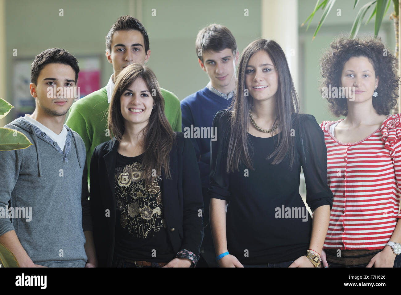 happy students people group portrait at university indoor building ...