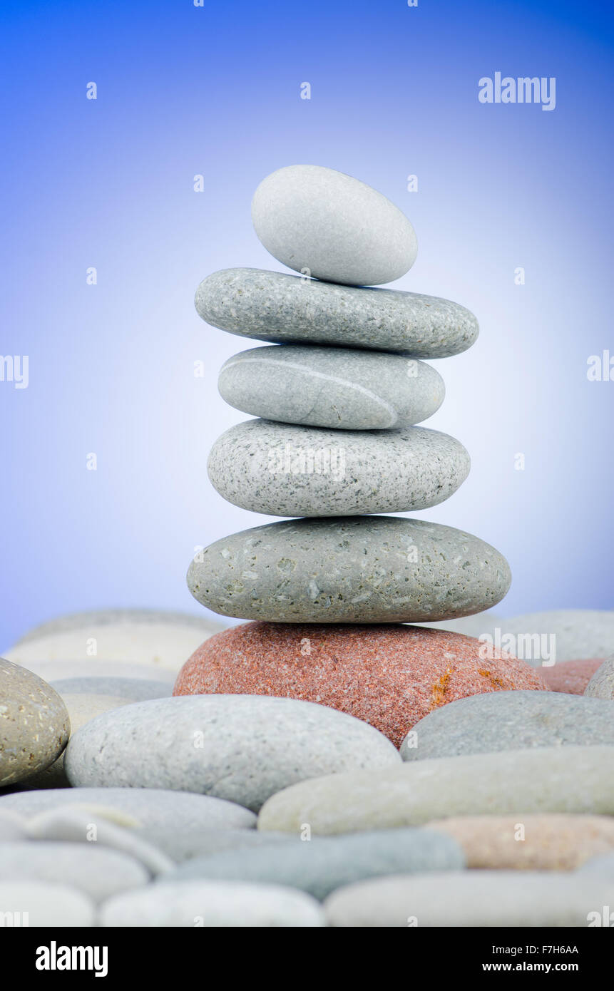 Pebbles stack against gradient background Stock Photo - Alamy