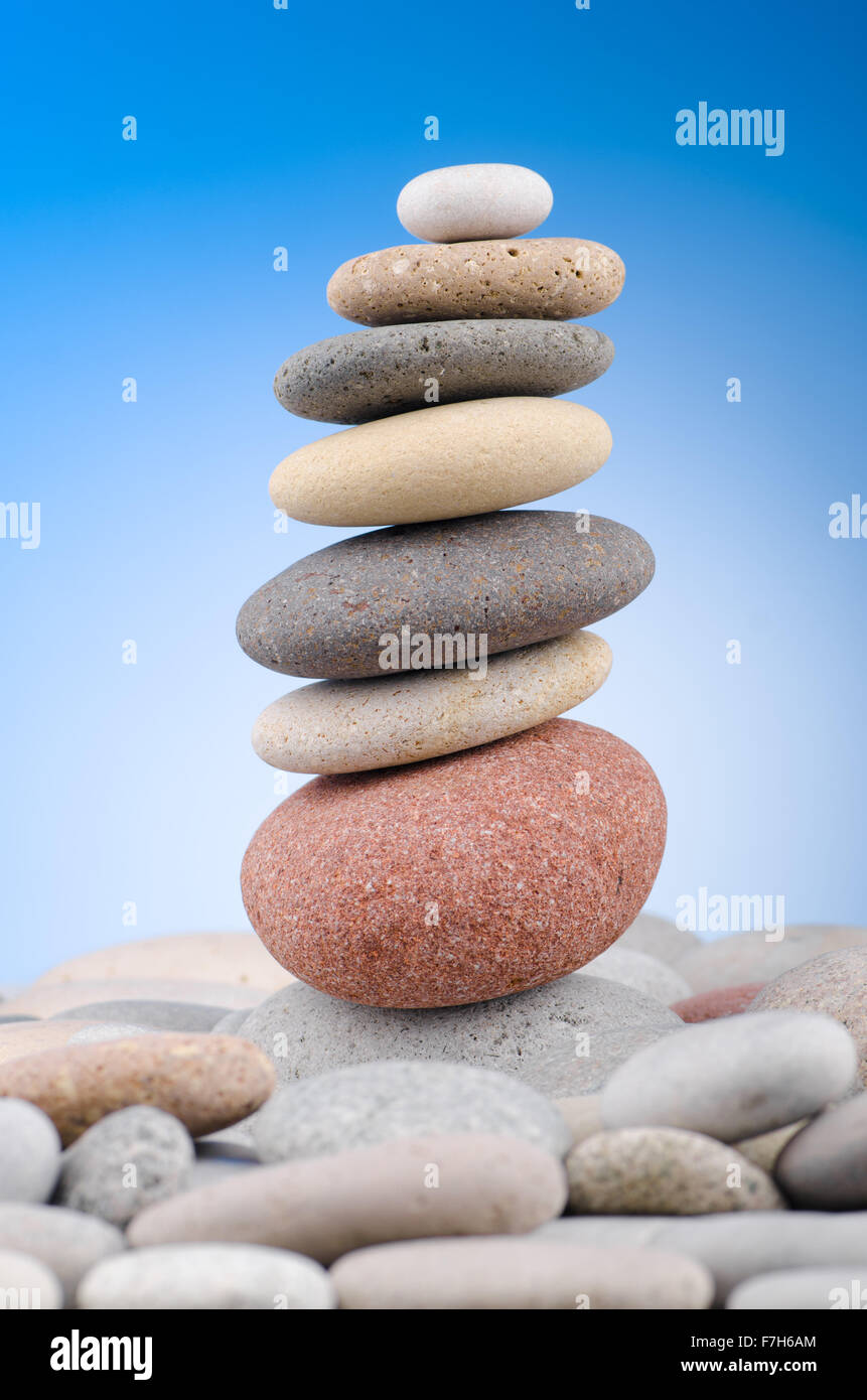 Pebbles stack against gradient background Stock Photo - Alamy