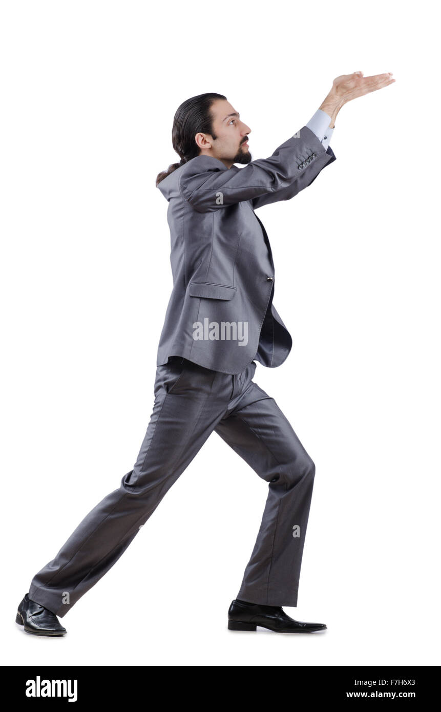 Businessman pushing away virtual obstacles Stock Photo - Alamy