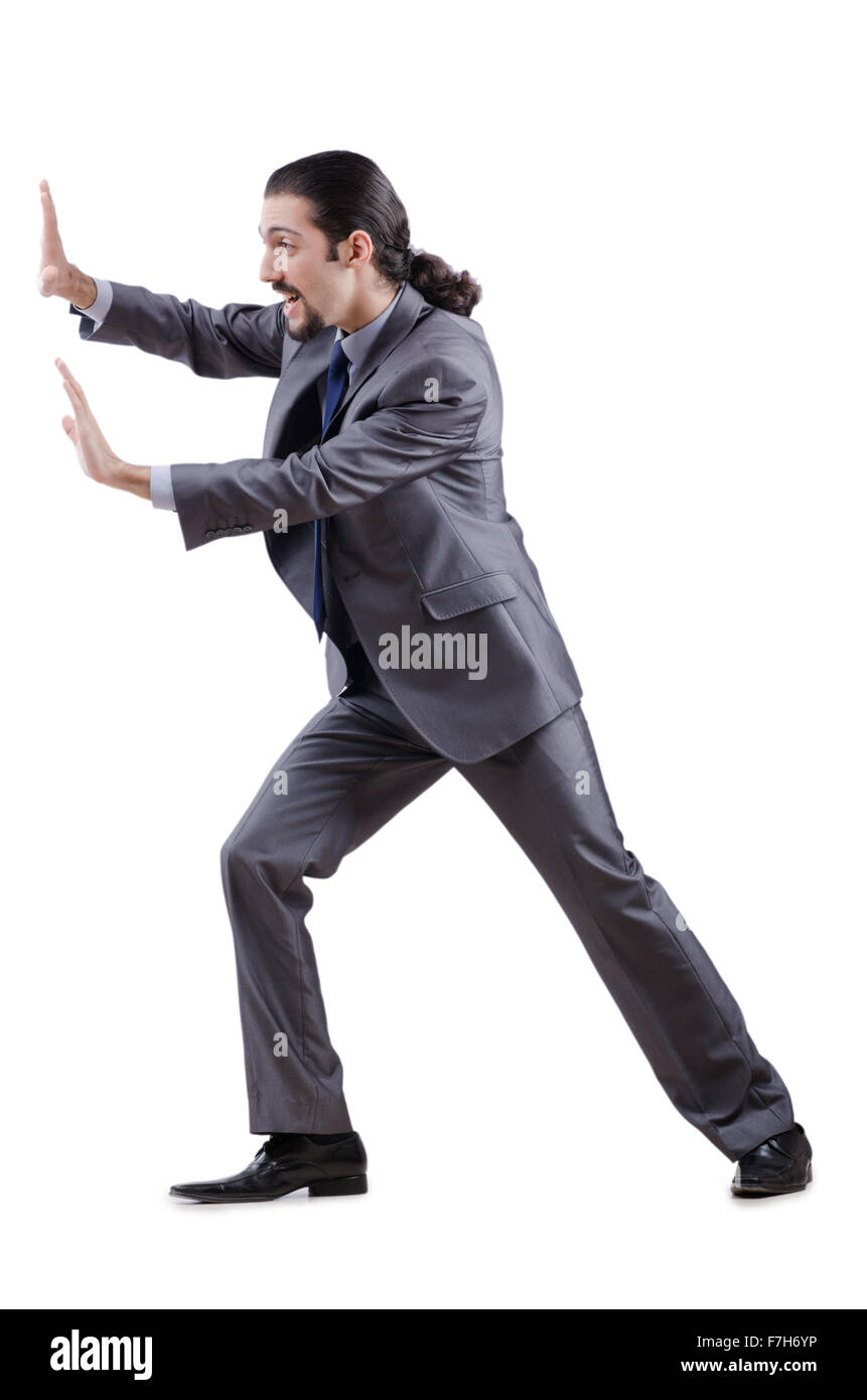 Businessman pushing away virtual obstacles Stock Photo - Alamy