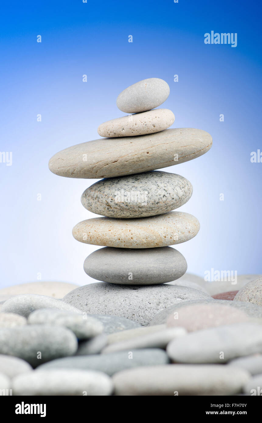 Pebbles stack against gradient background Stock Photo - Alamy