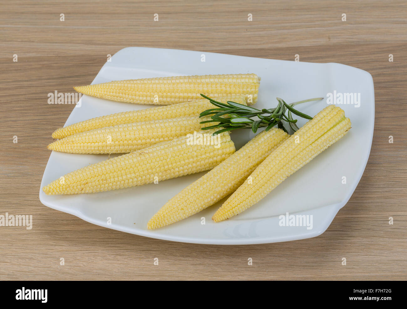 Fresh ripe Baby corn on the wood background Stock Photo - Alamy