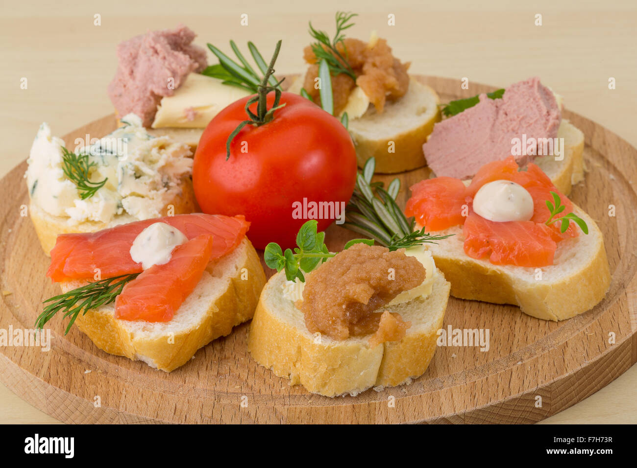 Assorted tapas with fish, blue cheese, caviar and liver Stock Photo - Alamy