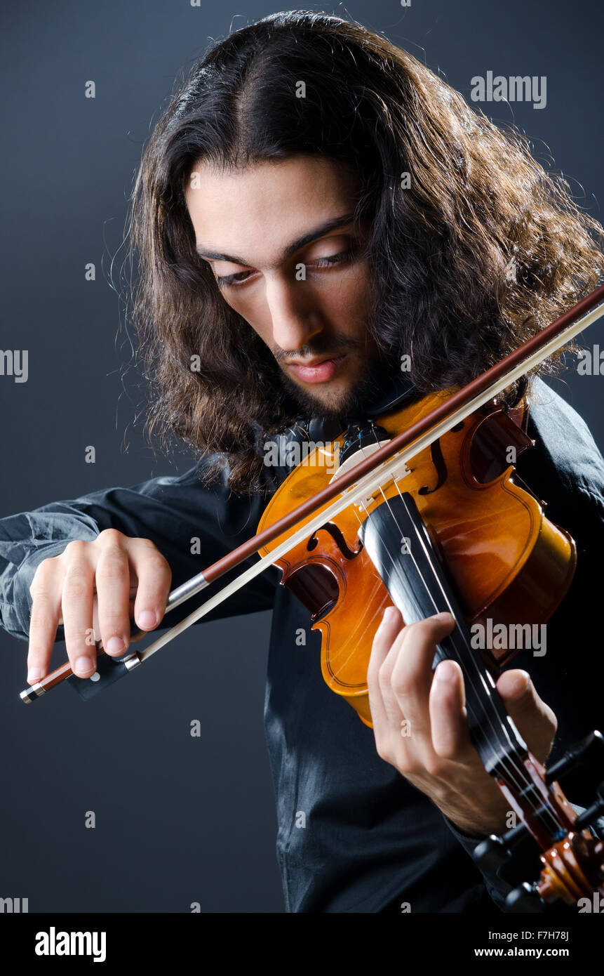 Young violin player playing Stock Photo - Alamy