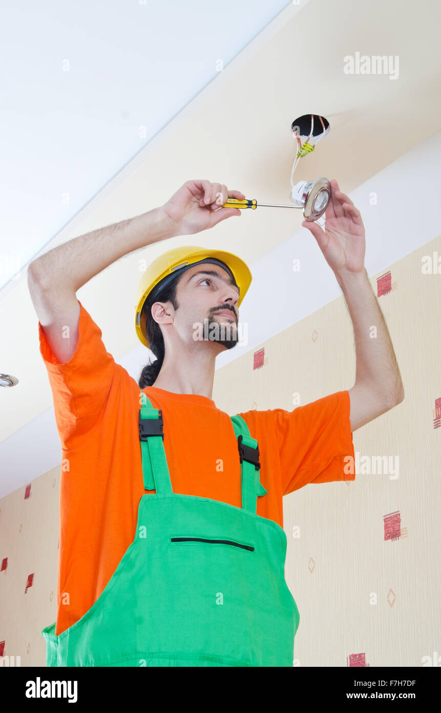 Electrician working on cabling lighting Stock Photo - Alamy