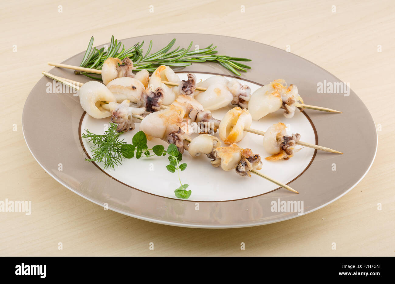 Grilled cuttlefish bbq with rosemary and pepper Stock Photo - Alamy