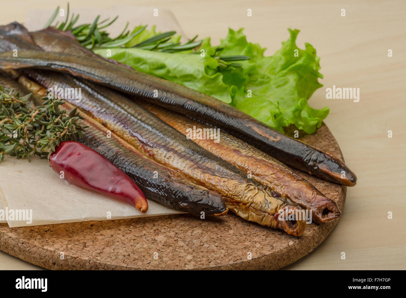 Smoked Lamprey - seafood delicacy with salad and herbs Stock Photo - Alamy
